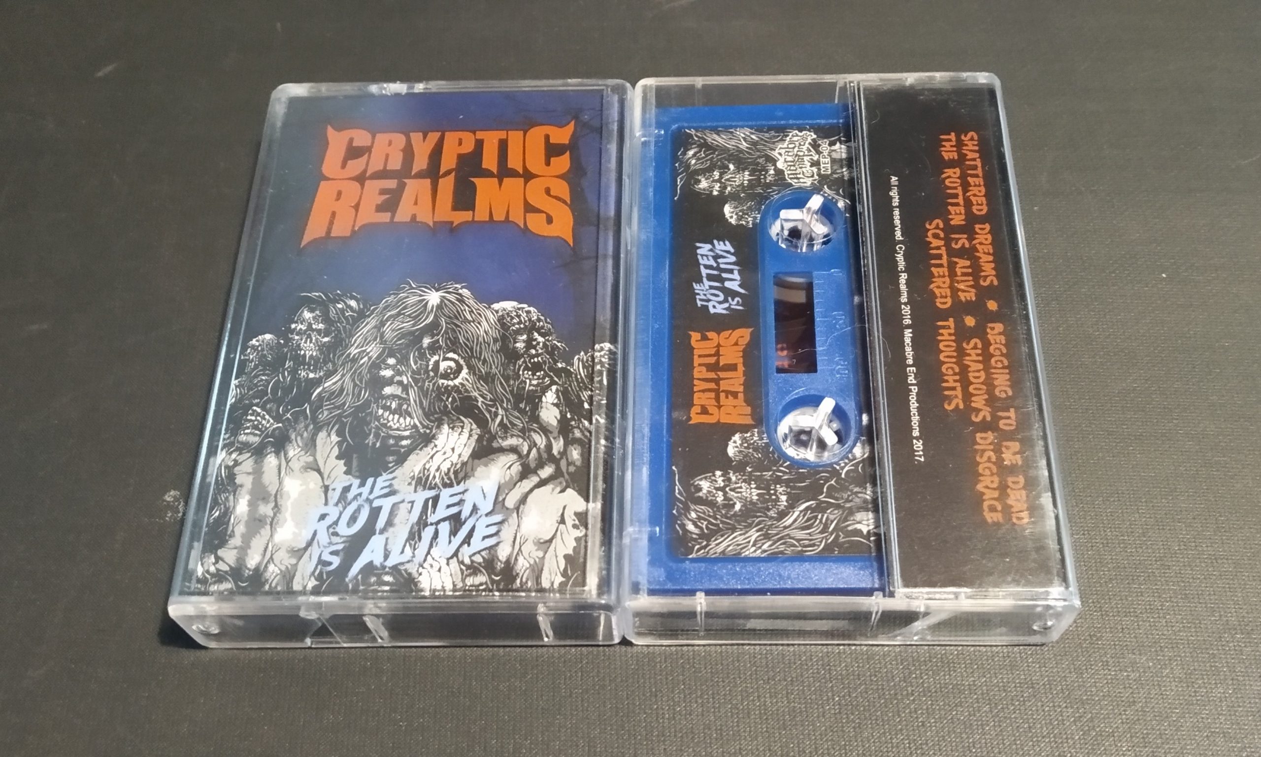 CRYPTIC REALMS – The Rotten is Alive (TAPE) – Disembodied Records Store
